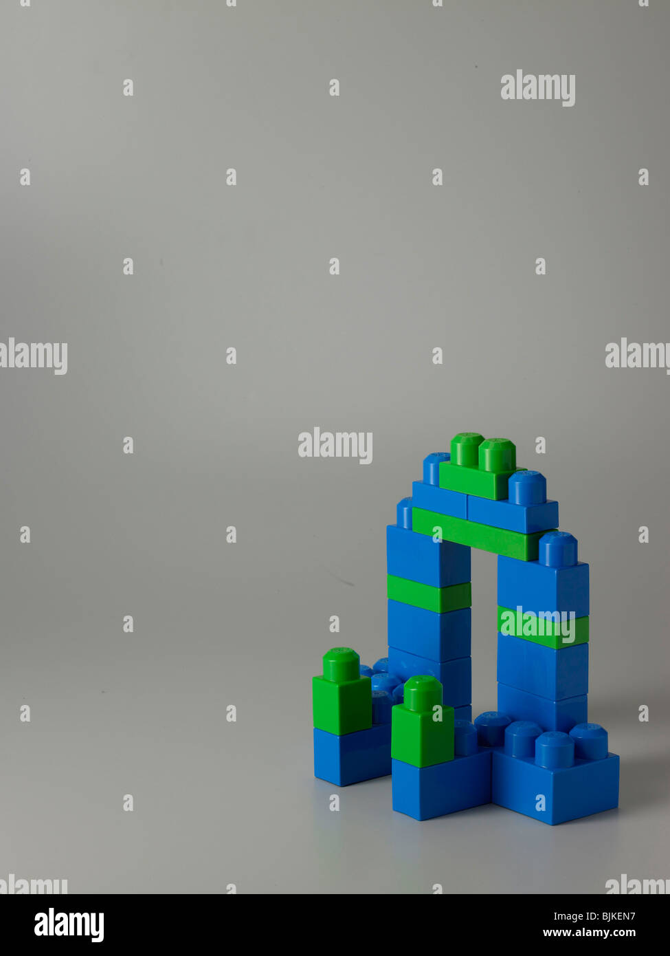 Toy blocks showing building and structure in portrait format. Blue and ...