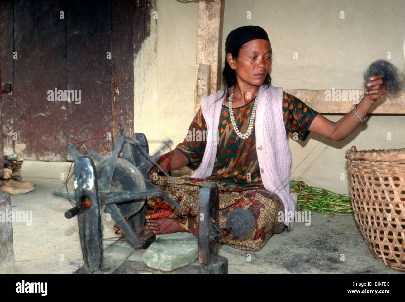 Weaving and spinning cloth. Pokhara. Nepal Stock Photo - Alamy