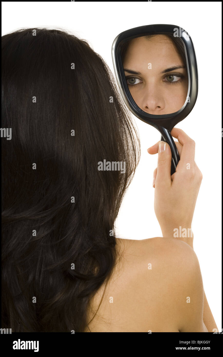 Reflection of woman smiling in hand mirror Stock Photo - Alamy