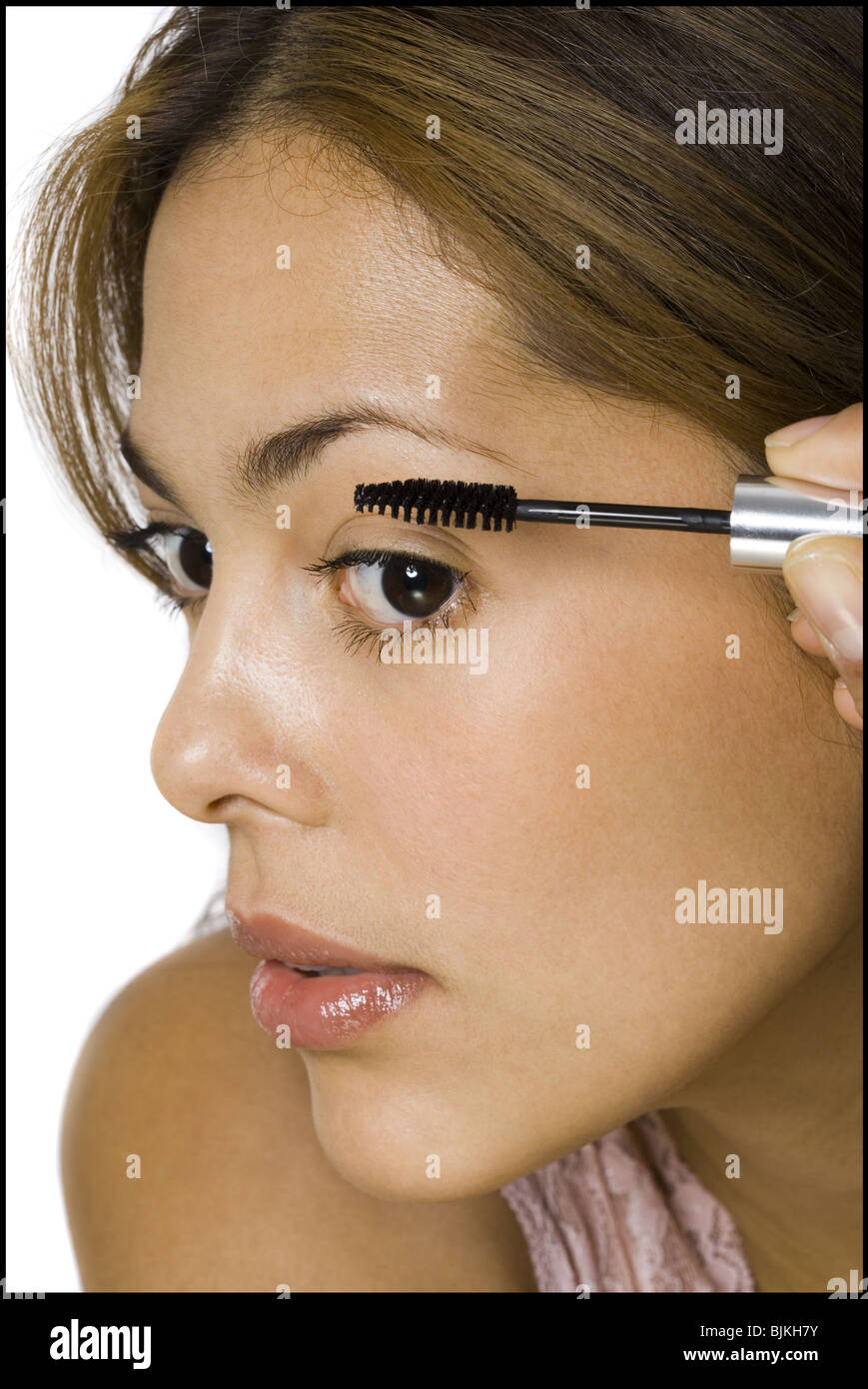 Closeup of woman applying mascara Stock Photo - Alamy