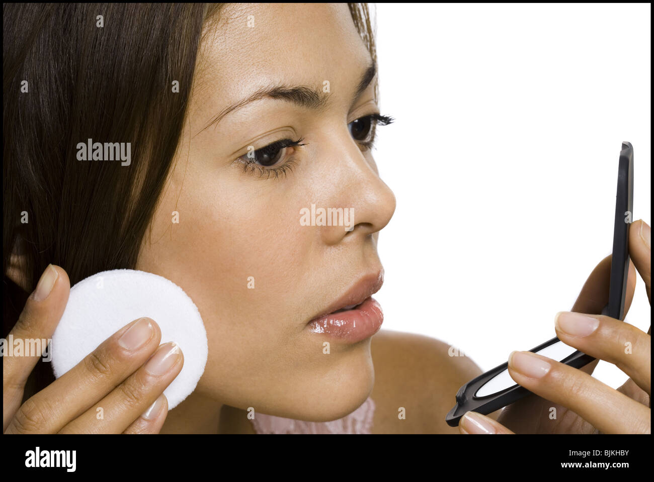 Closeup of woman with powder puff Stock Photo - Alamy