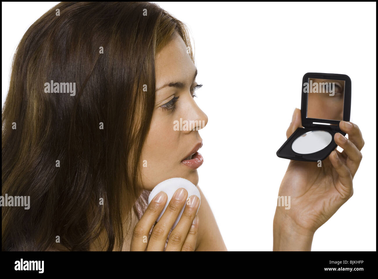 Closeup of woman with powder puff Stock Photo - Alamy