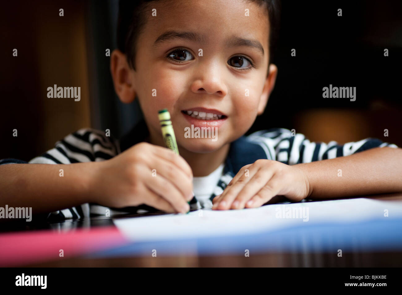 Portrait of young boy coloring Stock Photo - Alamy