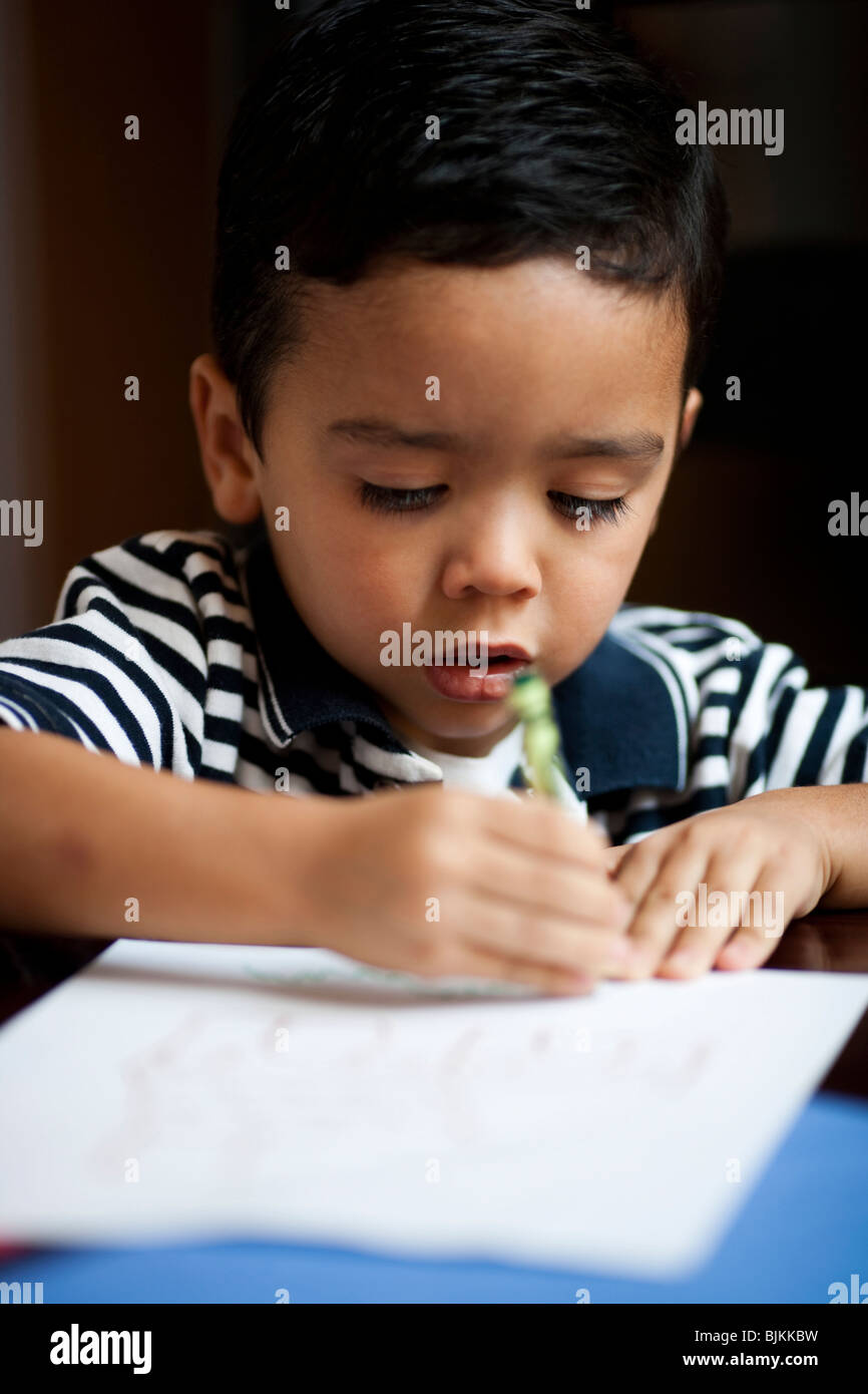 Portrait of young boy coloring Stock Photo - Alamy