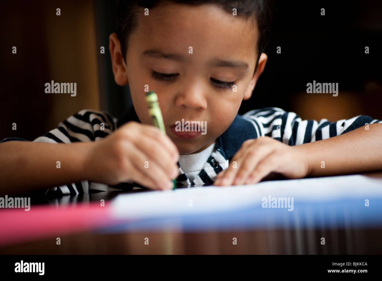 Young boy coloring Stock Photo - Alamy