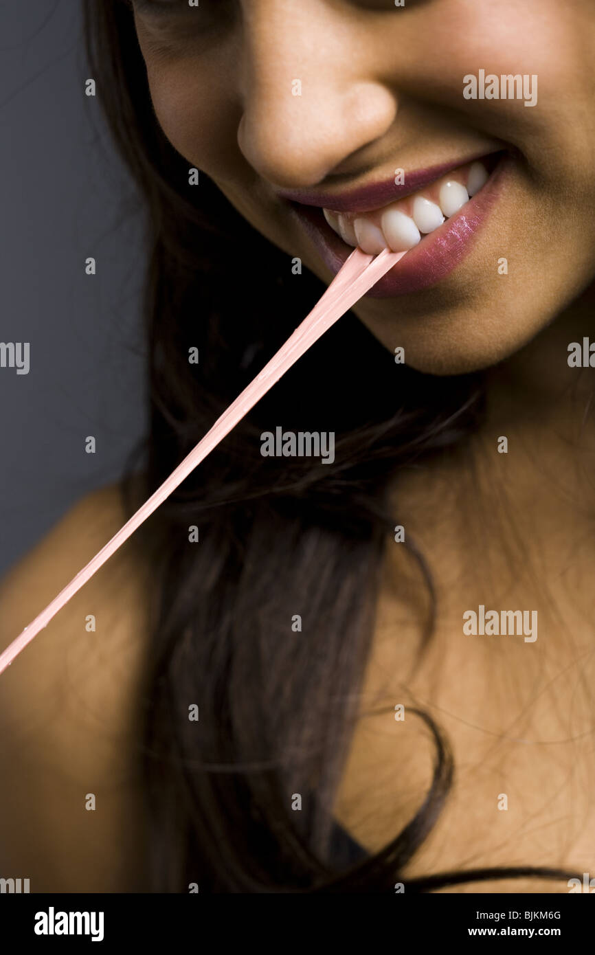 Closeup of woman chewing gum Stock Photo - Alamy