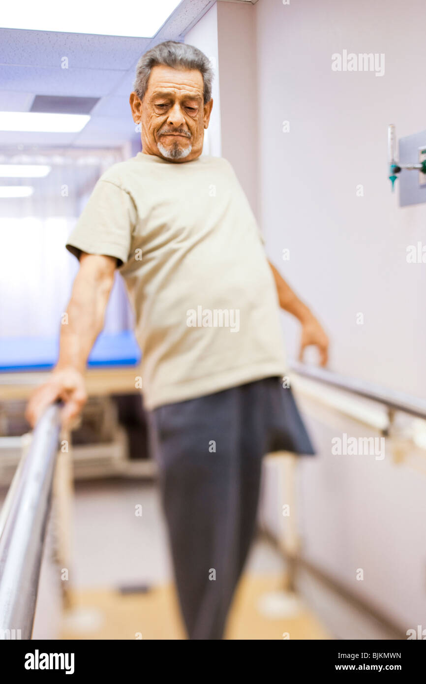 Older man with one leg walking Stock Photo - Alamy