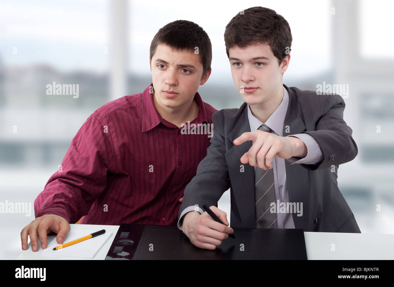 Two young people looking about some project Stock Photo - Alamy Two young people looking about some project Stock Photo - Alamy