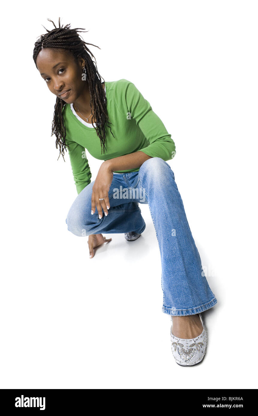 Crouching looking at camera Cut Out Stock Images & Pictures - Alamy