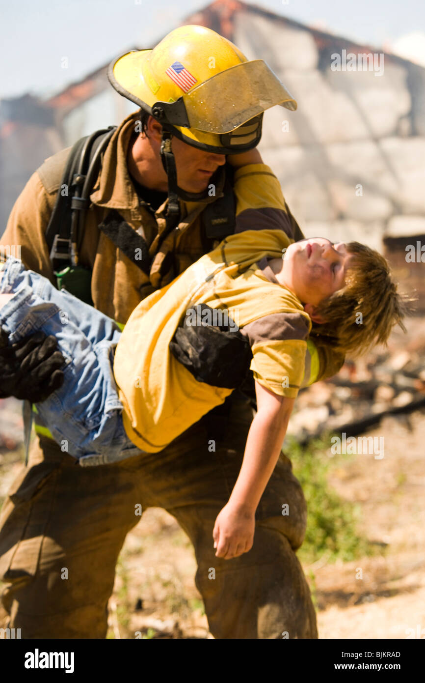 Fire fighter rescuing child Stock Photo - Alamy Fire fighter rescuing child Stock Photo - Alamy