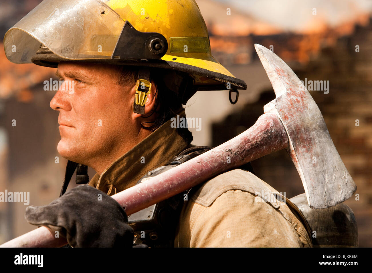 Fire fighter with axe Stock Photo - Alamy
