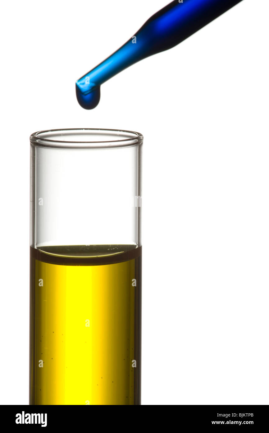 Dropper over test tube Stock Photo - Alamy
