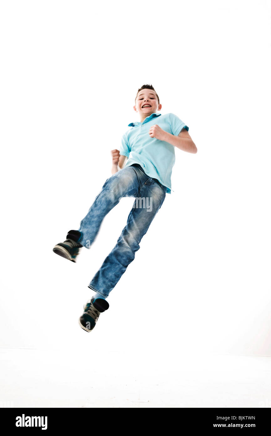 A boy leaping into the air Stock Photo - Alamy