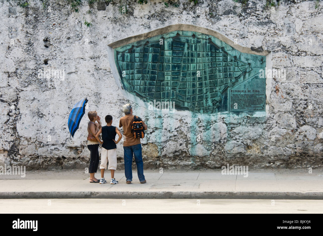 Tourists viewing a wall map made from copper in Havana Cuba Stock Photo ...