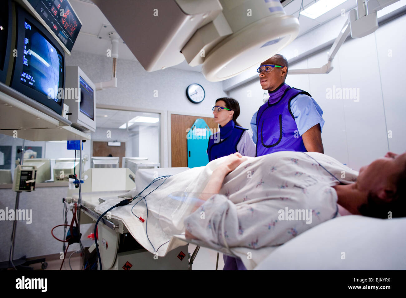 Woman undergoing x-ray in lab Stock Photo - Alamy