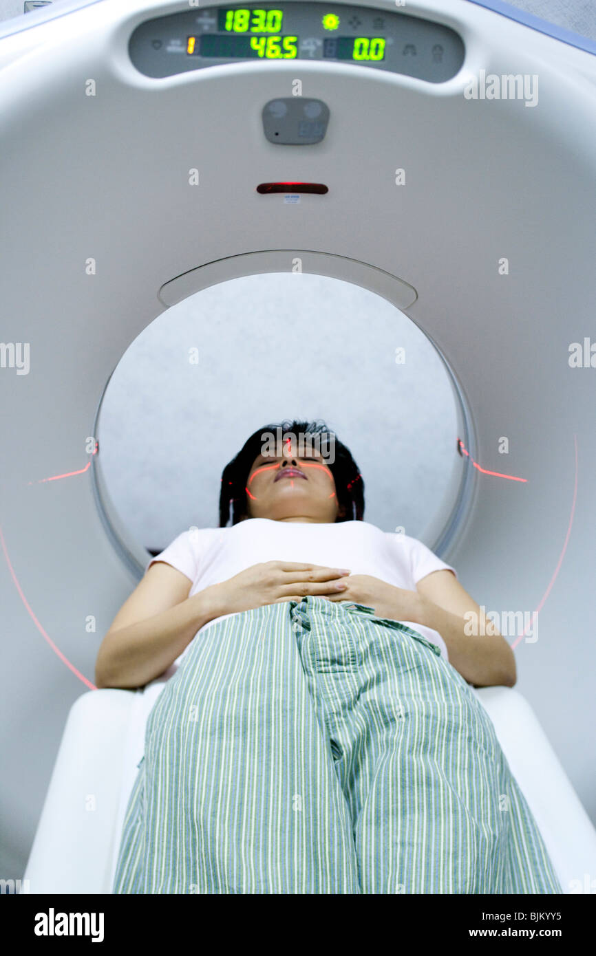 Woman entering MRI machine Stock Photo - Alamy