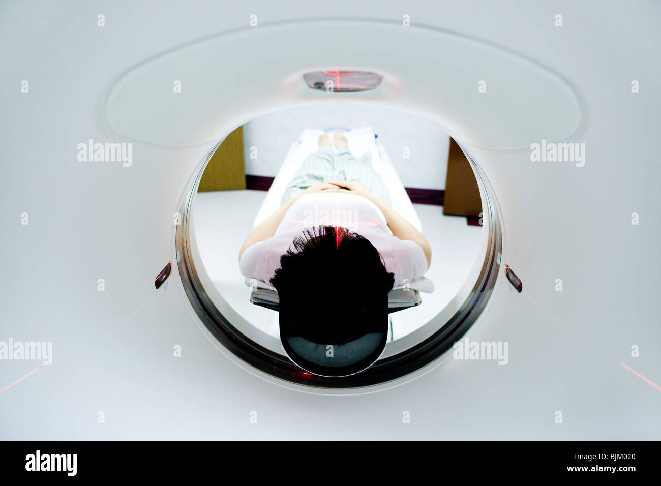 Patient entering MRI machine from behind Stock Photo - Alamy