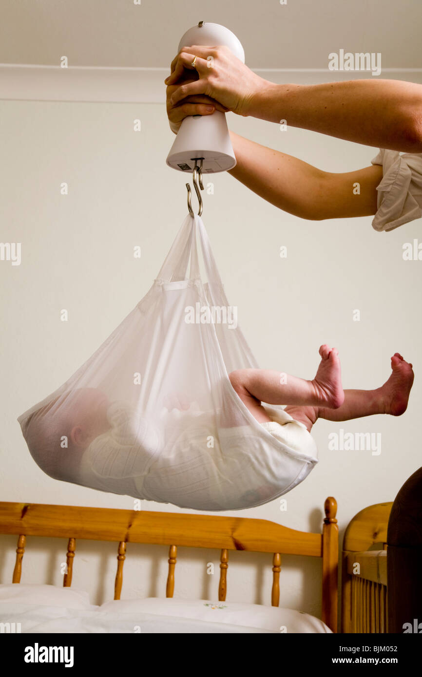 Weighing a newborn / new born baby with scales / weight scale Stock ... Weighing a newborn / new born baby with scales / weight scale Stock ...
