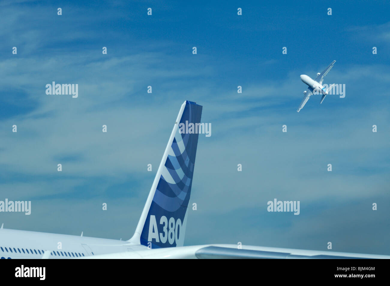 Airliners Airbus A380 tail fin and an Airbus A300 taking off during ...