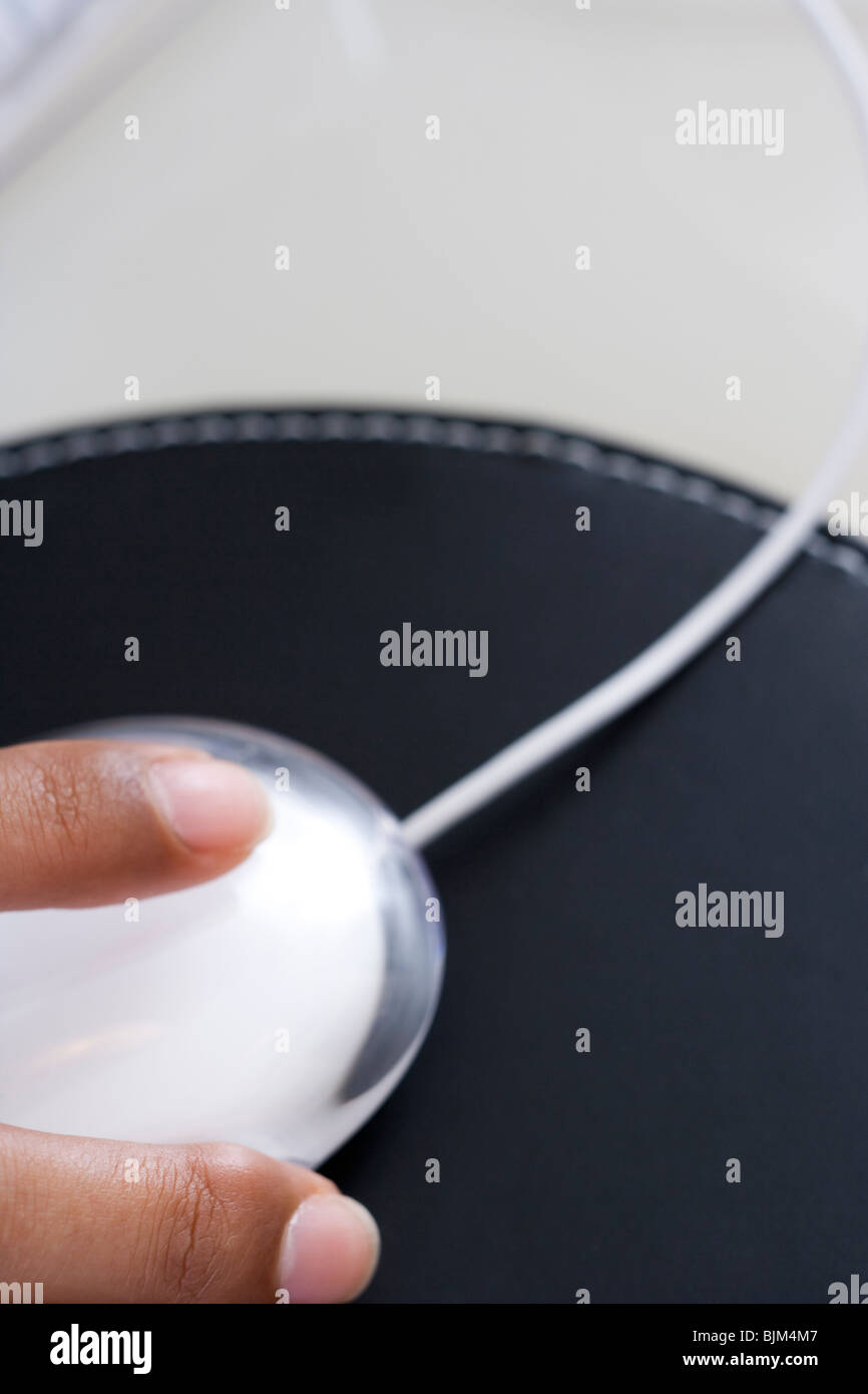 Female hand on mouse Stock Photo - Alamy