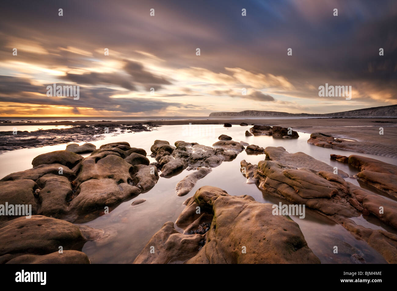 Sun setting over Compton Bay. Isle of Wight, England, UK Stock Photo ...