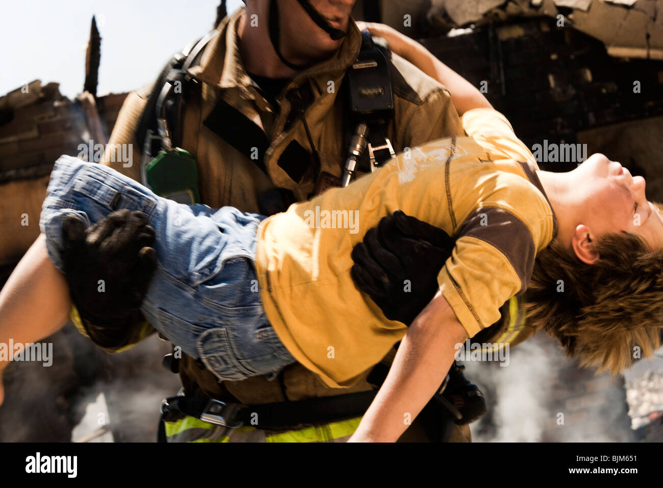 Male firefighter rescuing child hi-res stock photography and images - Alamy