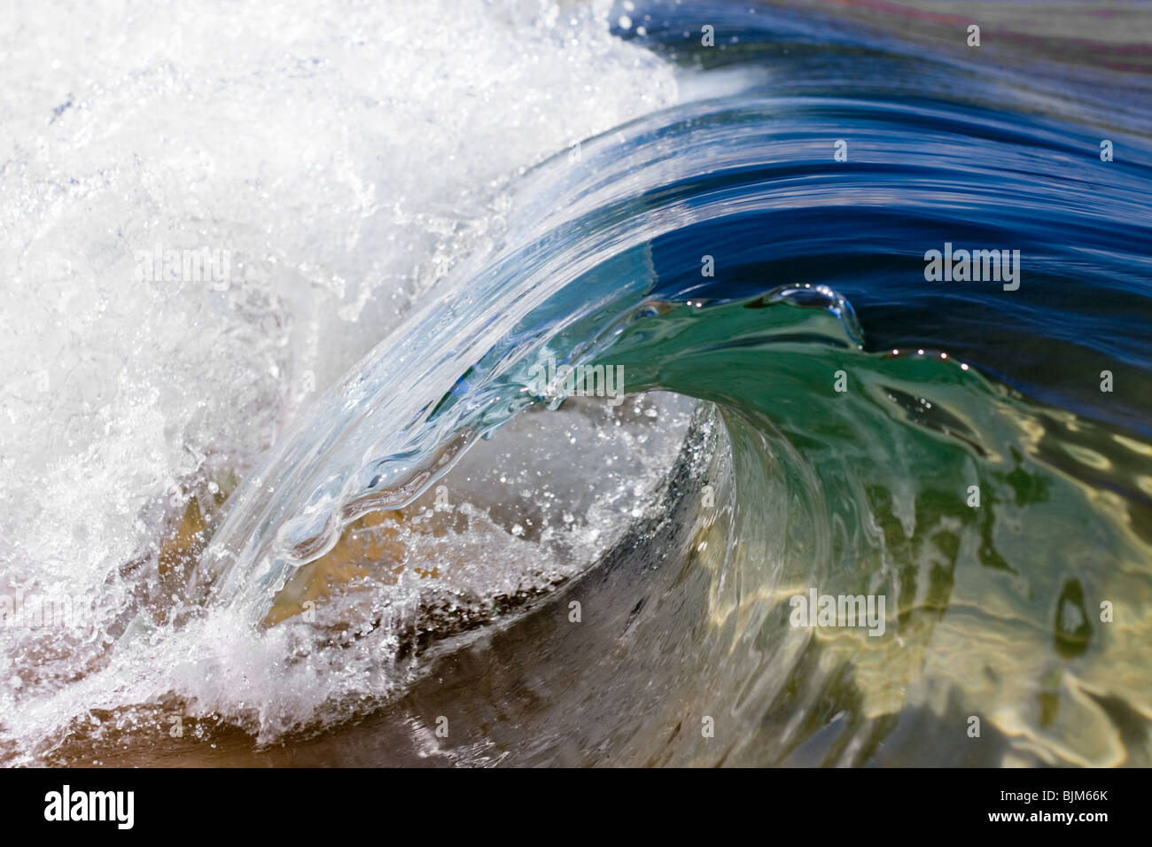A smooth liquid wave breaking perfectly Stock Photo - Alamy