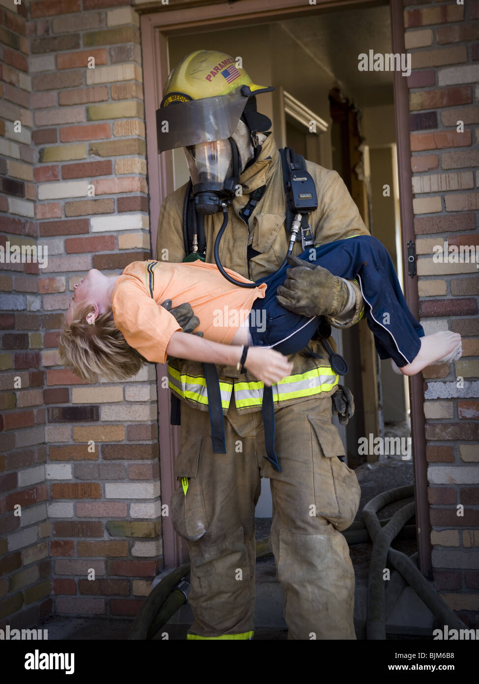 Fire fighter rescuing child Stock Photo - Alamy Fire fighter rescuing child Stock Photo - Alamy