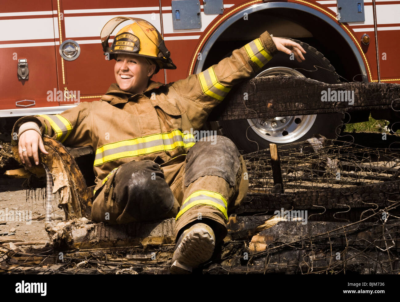 Portrait of a firefighter smiling Stock Photo - Alamy