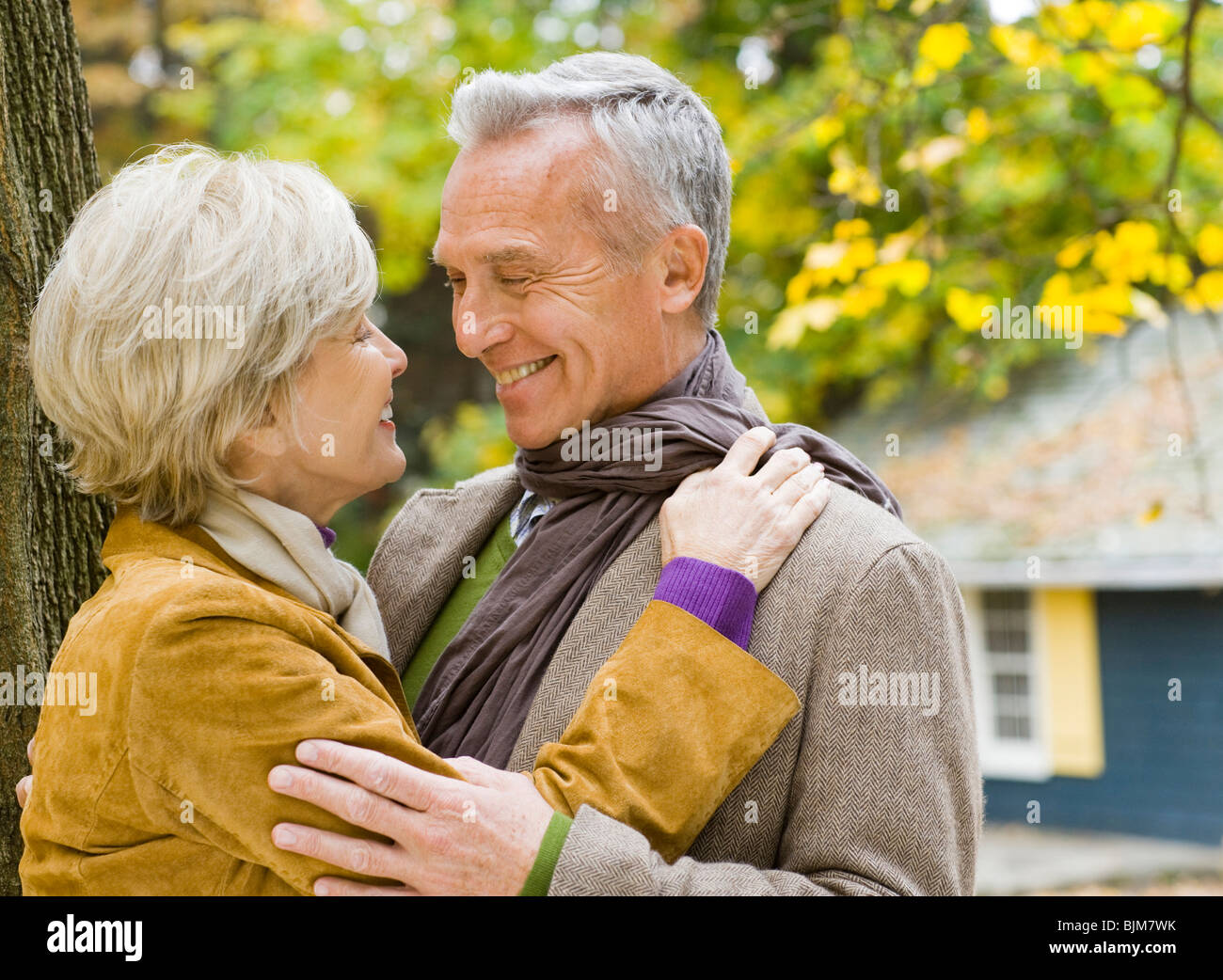 Mature couple embracing outdoors Stock Photo - Alamy
