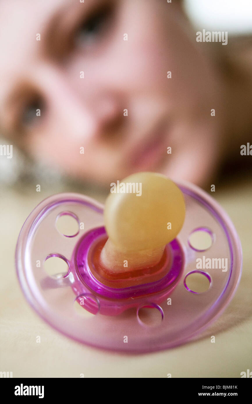Pacifier, thoughtful woman's face Stock Photo - Alamy
