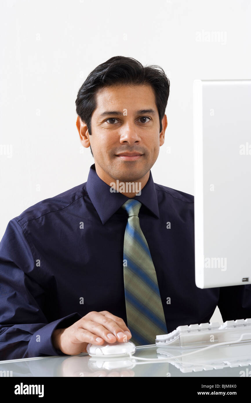 Man working at a computer Stock Photo - Alamy