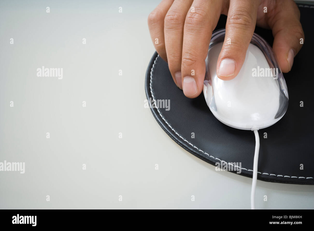 Hand using a mouse Stock Photo - Alamy