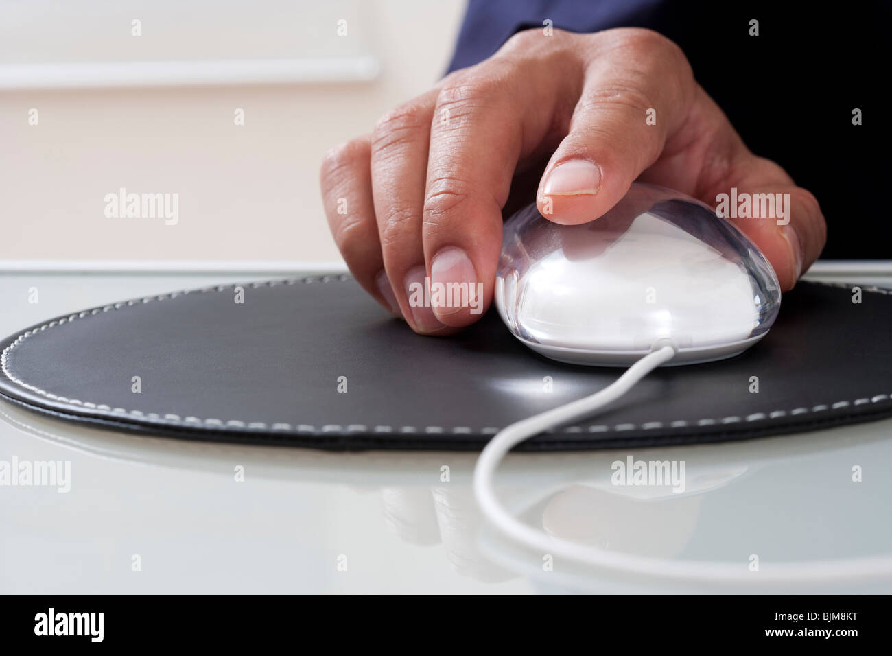 Hand using a mouse Stock Photo - Alamy