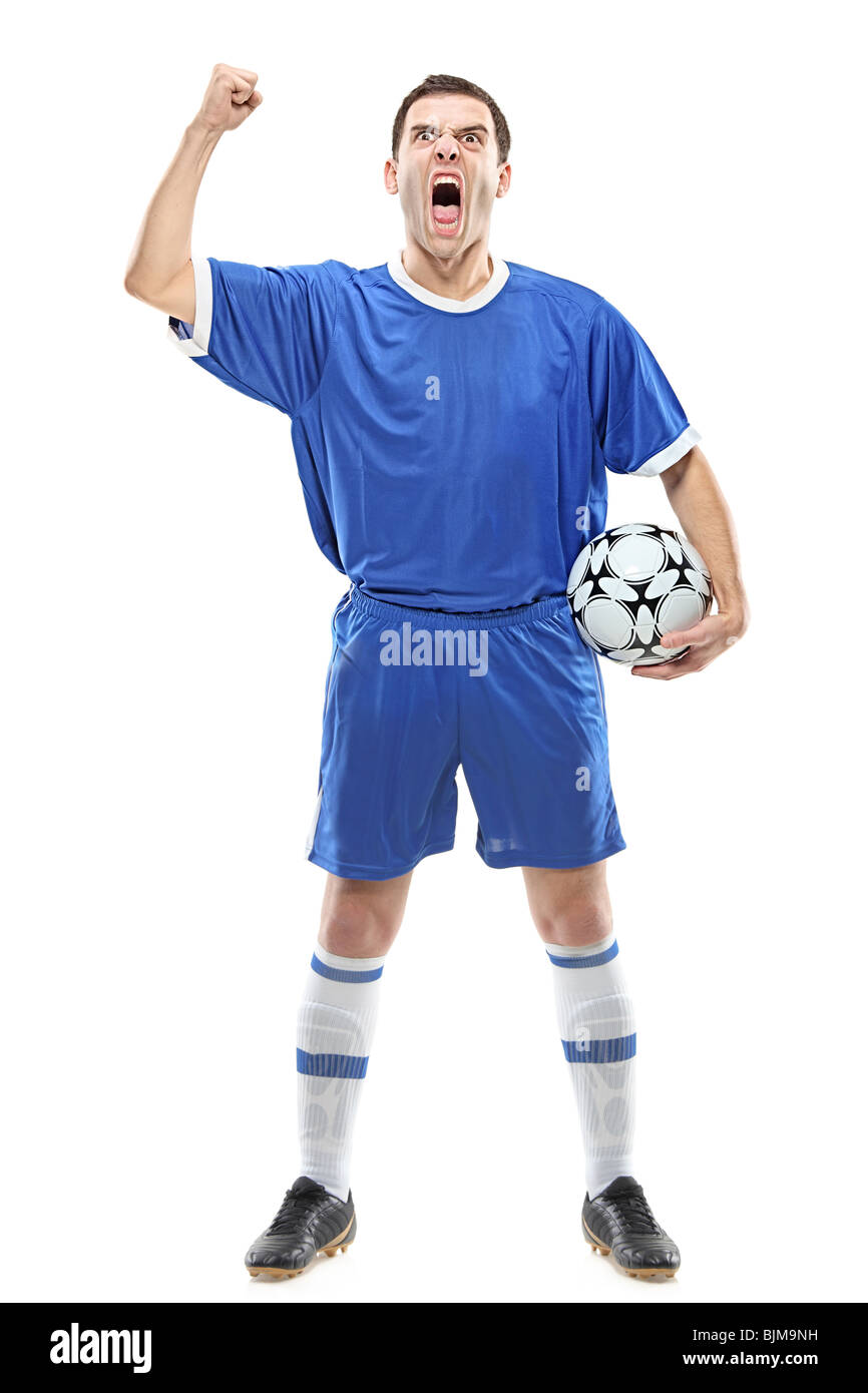 Soccer player with a ball screaming Stock Photo - Alamy