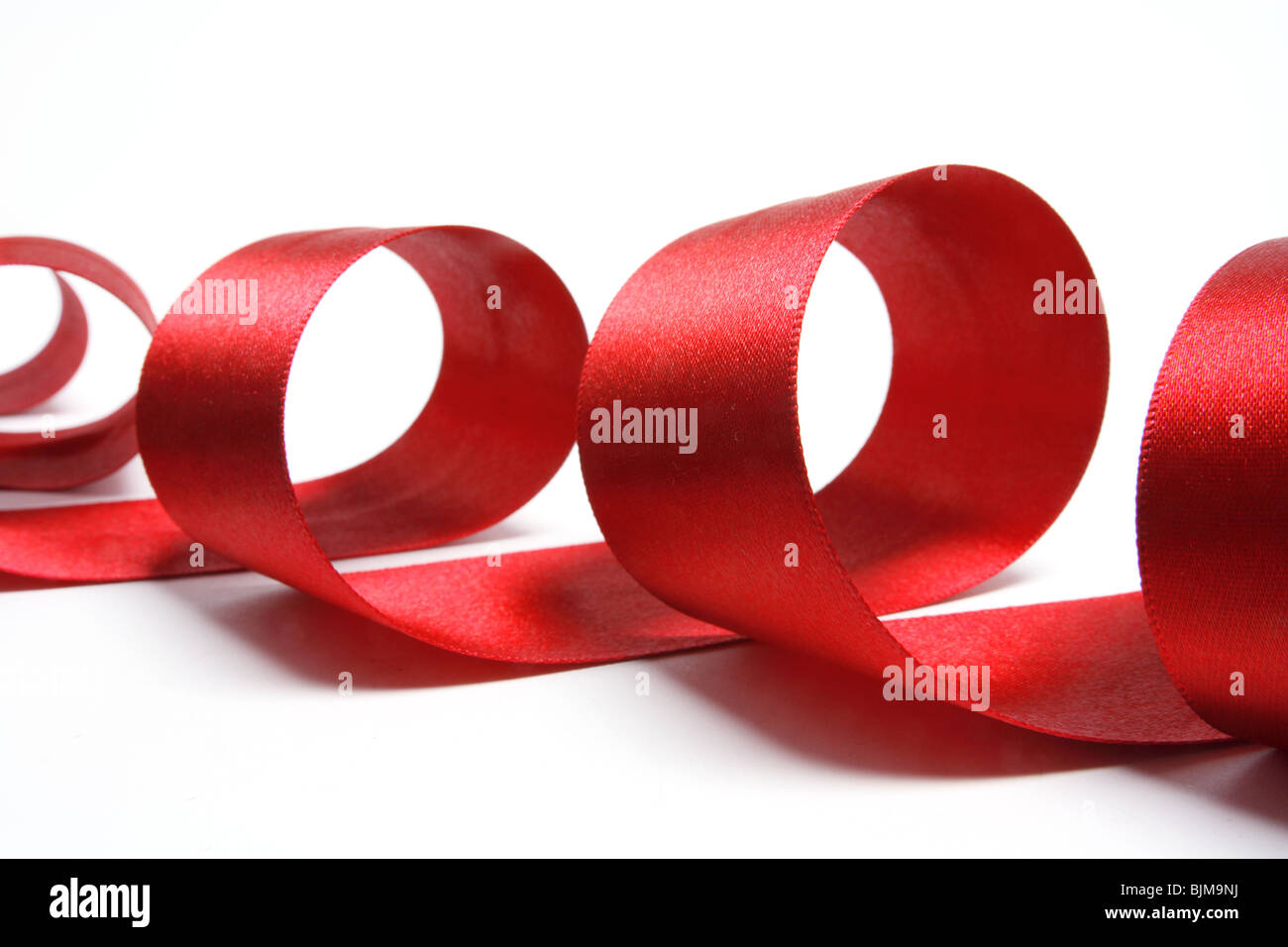 Strip of Red Curling Gift Ribbon Stock Photo - Alamy