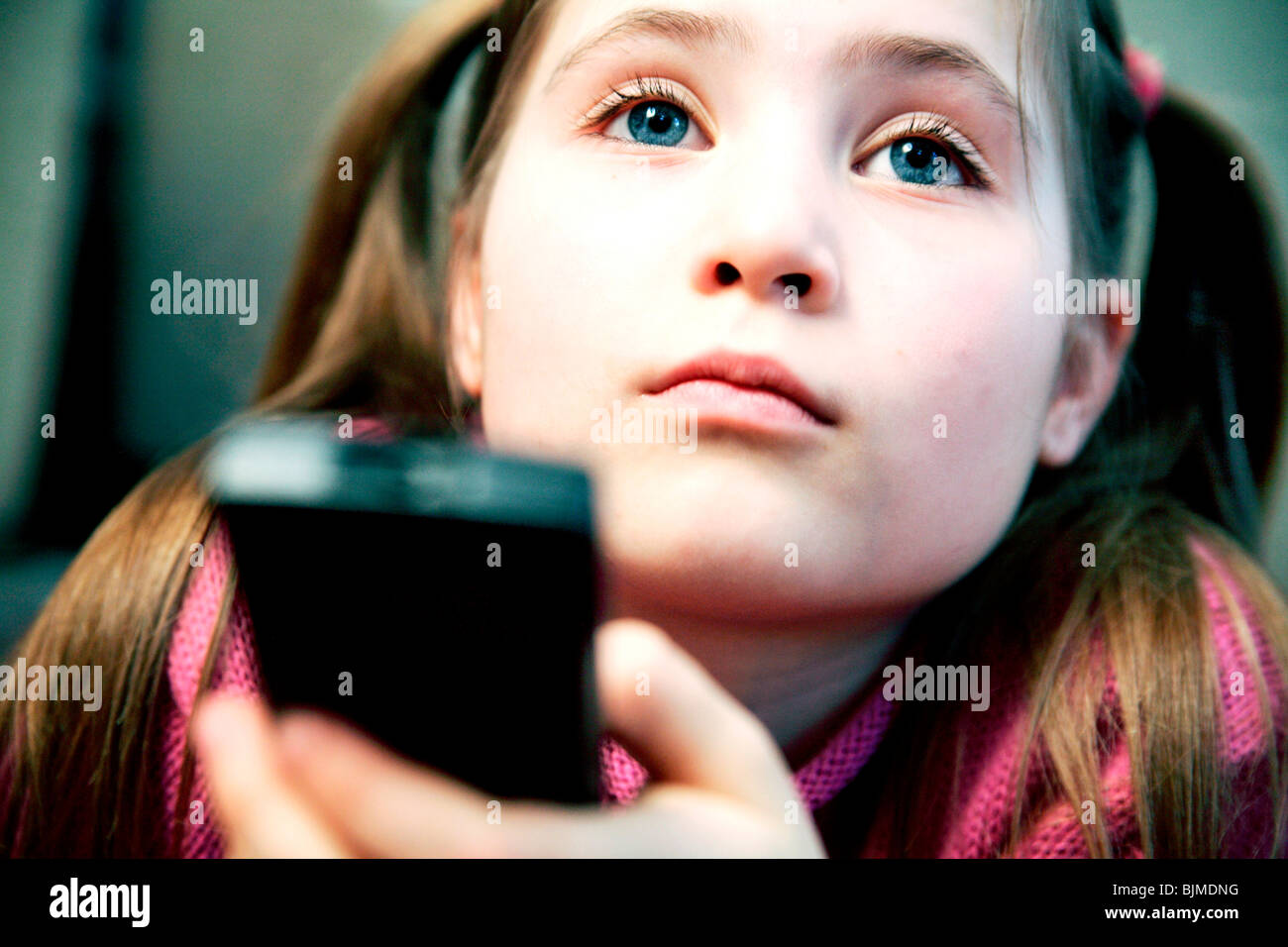 Old women holding tv remote hi-res stock photography and images - Alamy