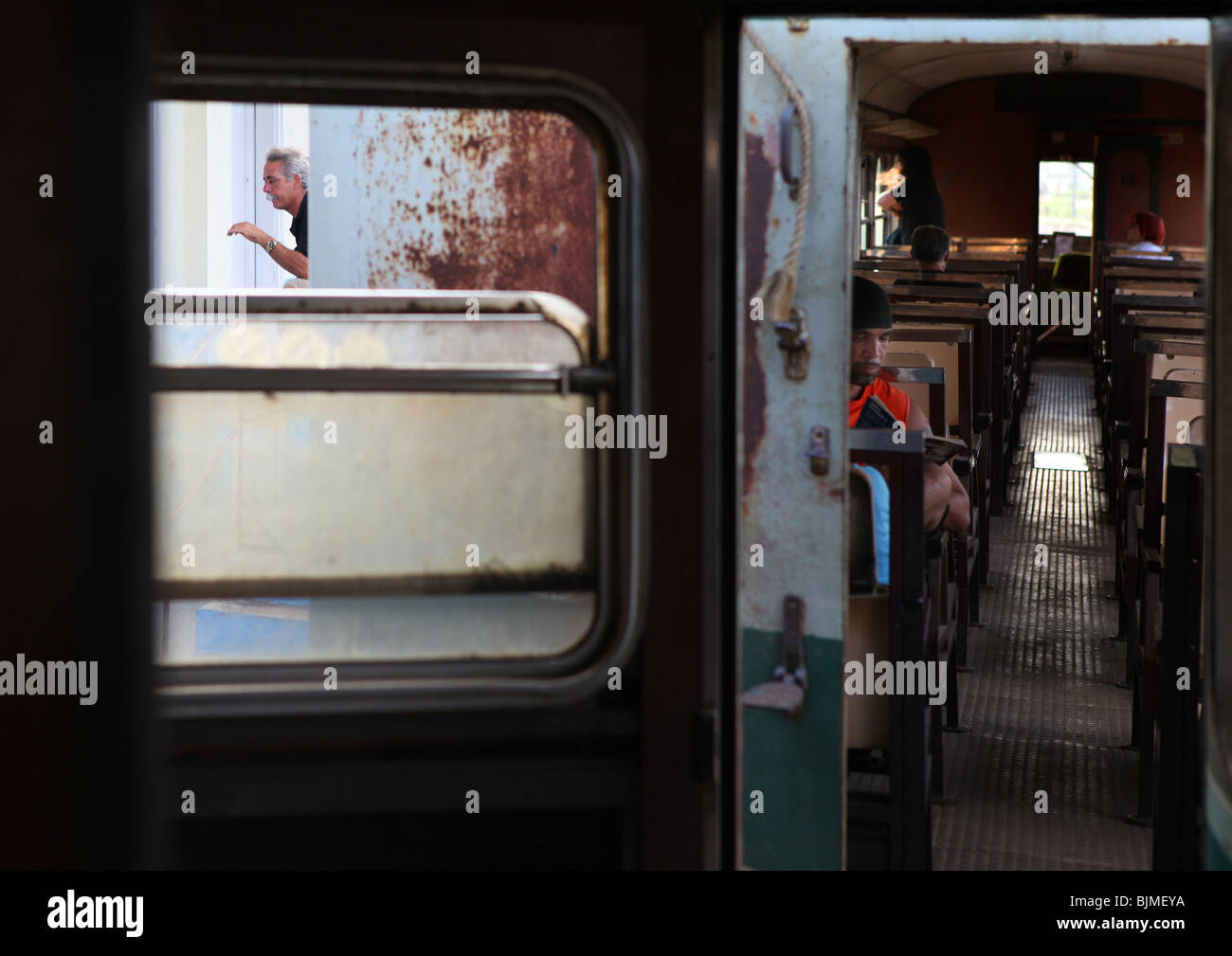 Travelers take a break along with the world's oldest electric train at ...