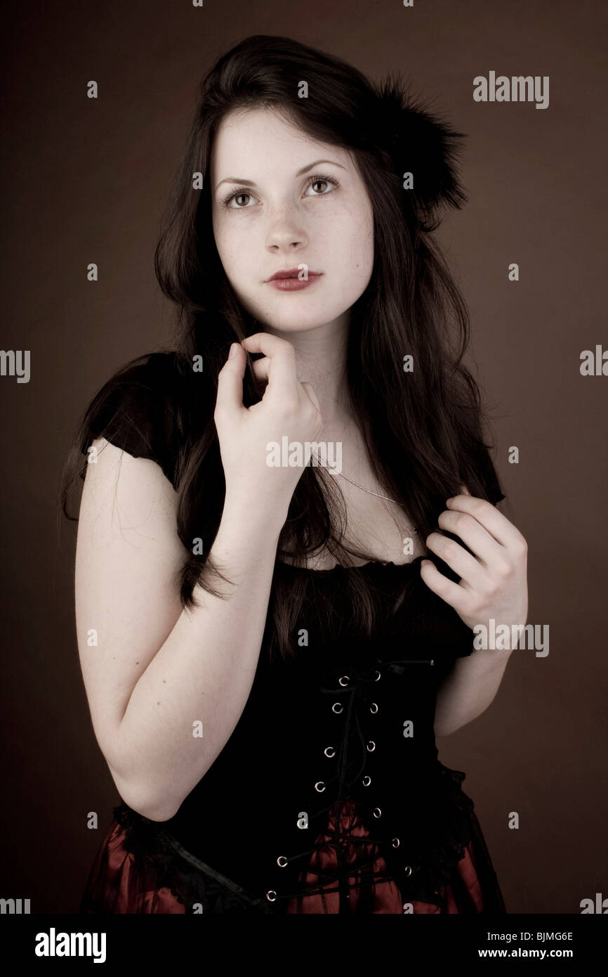 Woman, dark-haired, young, serious Stock Photo - Alamy