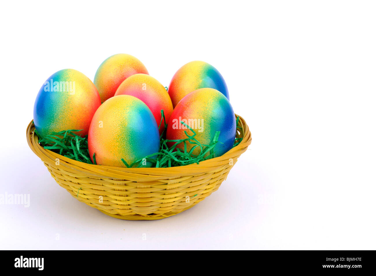 Colorful Easter basket with colorful, dyed Easter eggs Stock Photo - Alamy