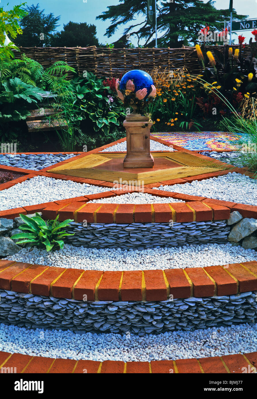 A terraced patio garden with decorative brick work Stock Photo - Alamy