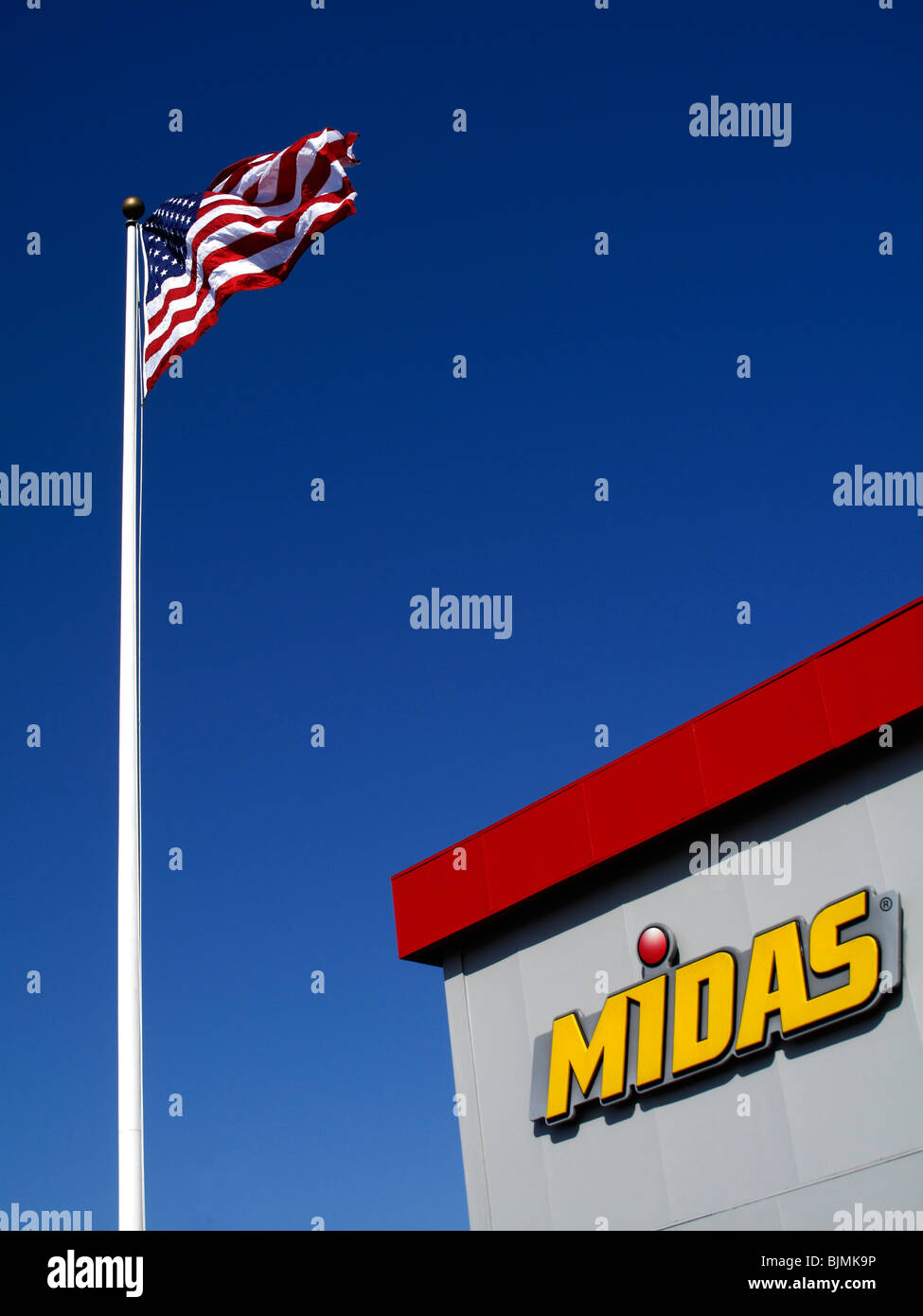 Midas sign and United States flag in San Jose California Stock Photo ...