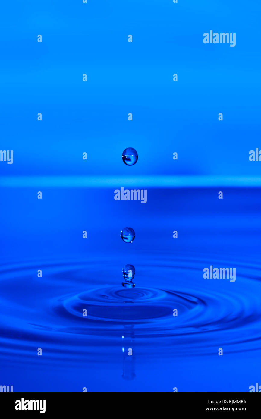 Water drop hitting a water surface Stock Photo - Alamy Water drop hitting a water surface Stock Photo - Alamy