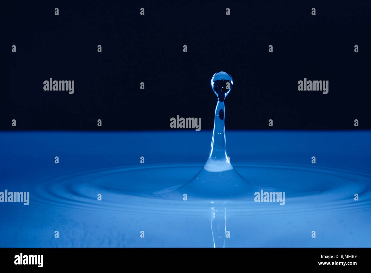 Water drop hitting a water surface Stock Photo - Alamy
