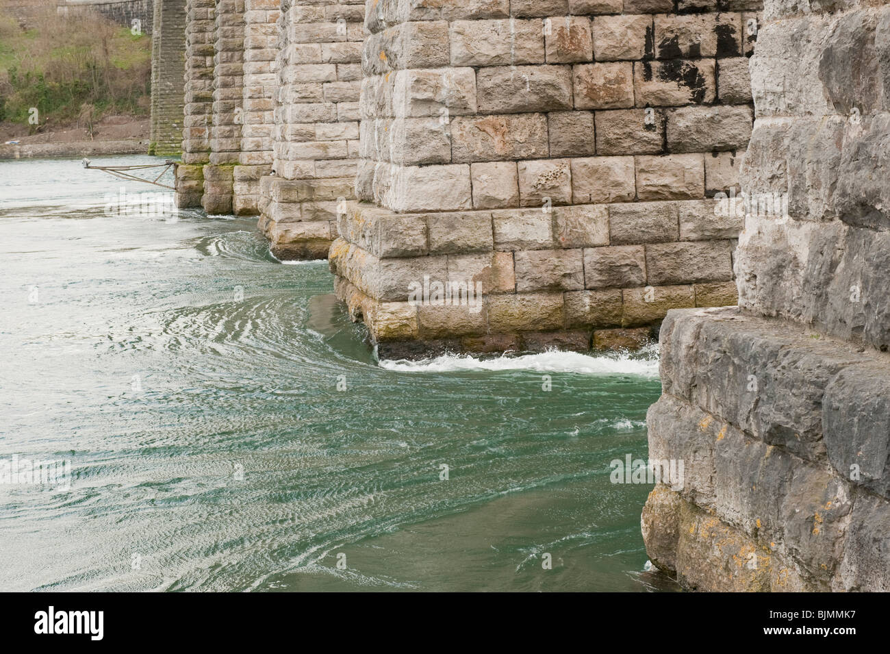 Menai Bridge Anglesey stanchions water flowing fast Stock Photo - Alamy
