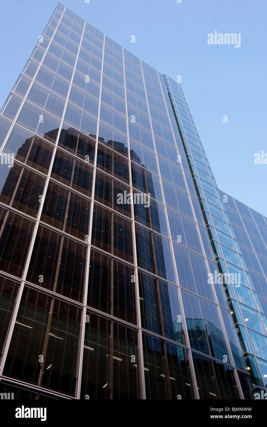Reflected buildings in glass cladding Stock Photo - Alamy