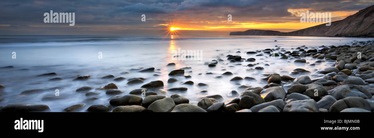 Sun setting over the rocks at Compton Bay. Isle of Wight, England, UK ...