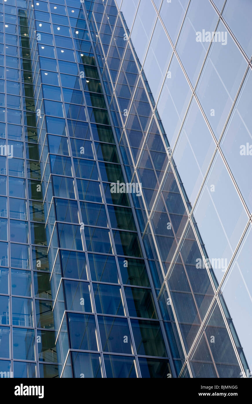 Reflected buildings in glass cladding Stock Photo - Alamy