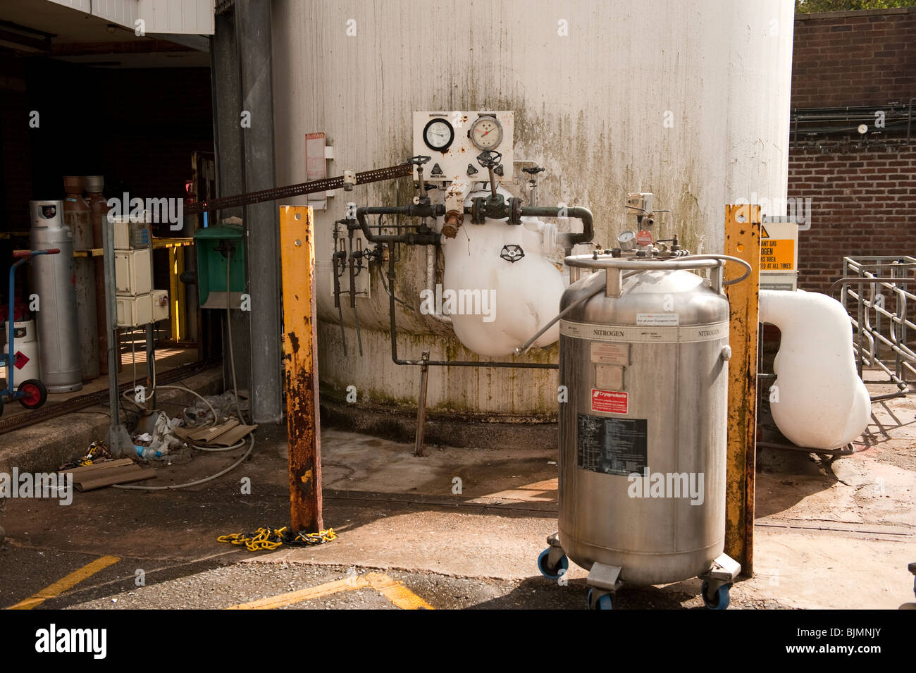 Liquid Nitrogen bulk tank and smaller tank with ice formed on pipework ...