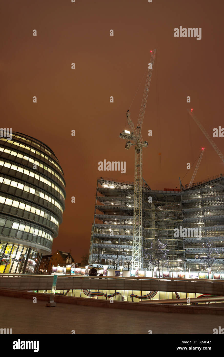 Office block and construction site at nighttime Stock Photo - Alamy